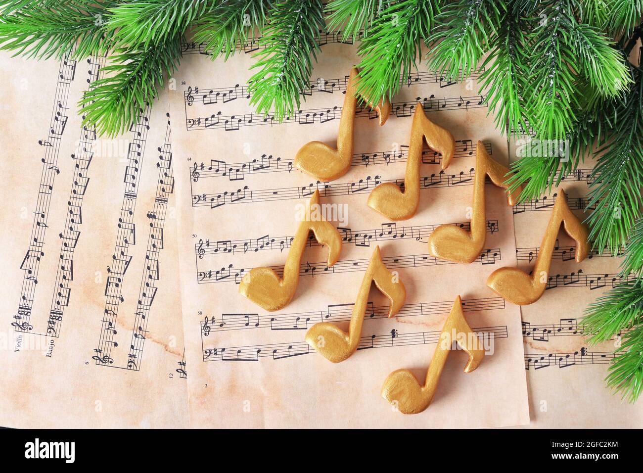 Christmas treble clef and music notes on paper background Stock Photo ...