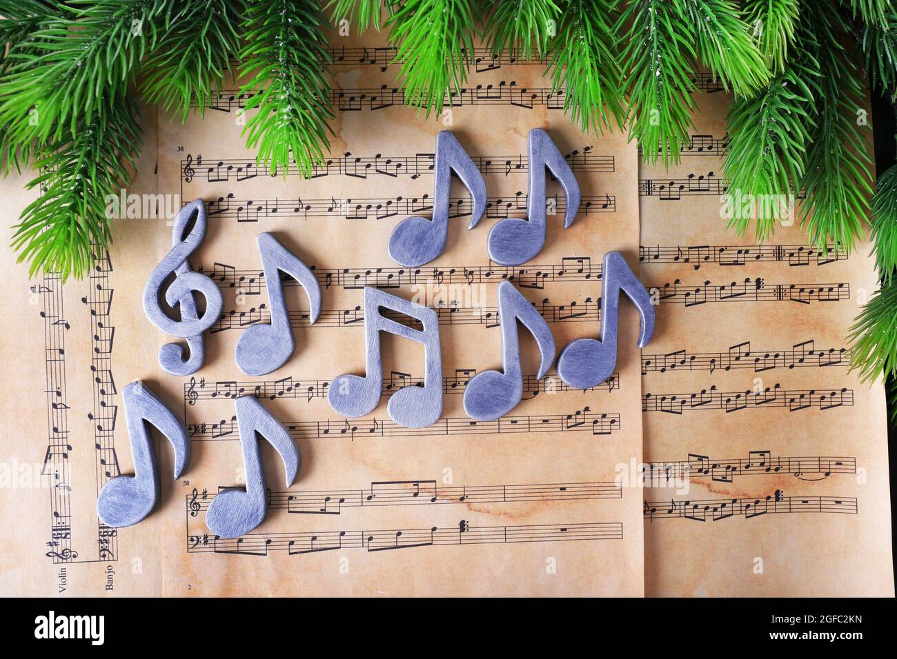 Christmas treble clef and music notes on paper background Stock Photo ...