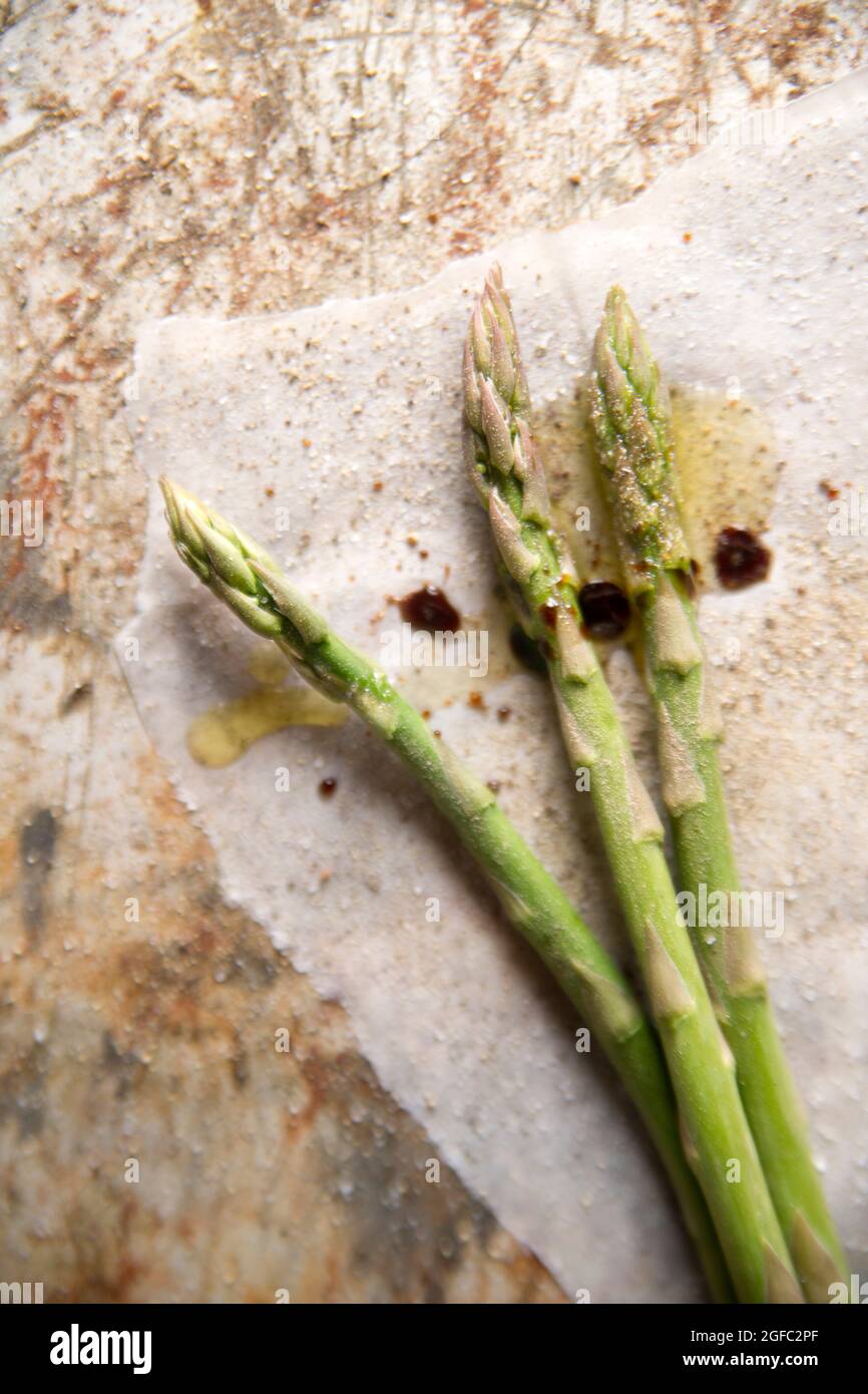 Presentation of some raw asparagus on metal background Stock Photo - Alamy