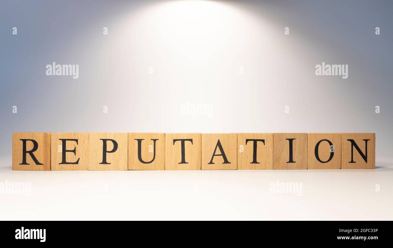 The word reputation was crafted from wooden cubes.finance and people ...