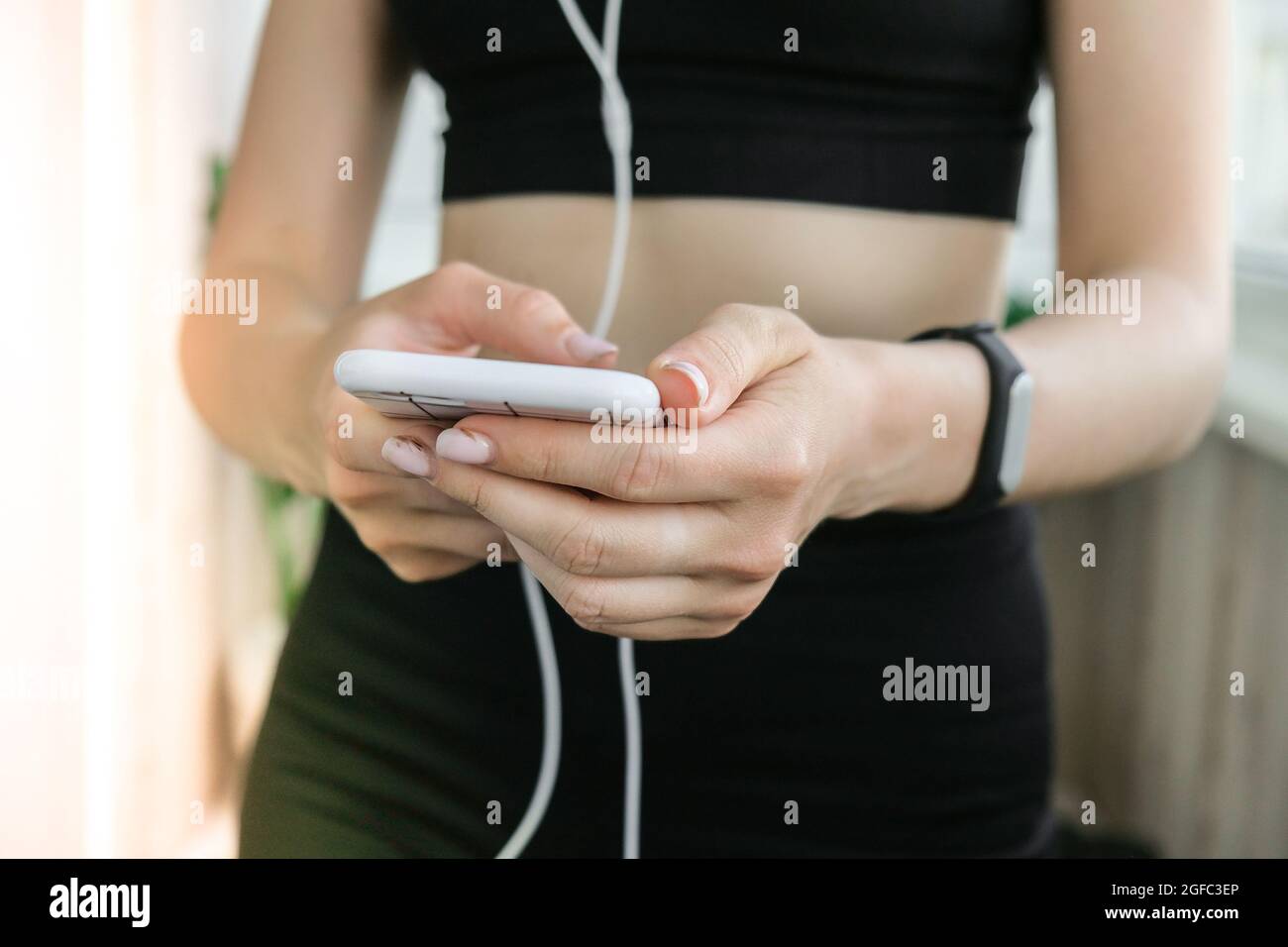 Modern gadgets for training at home. Woman using fitness app on ...