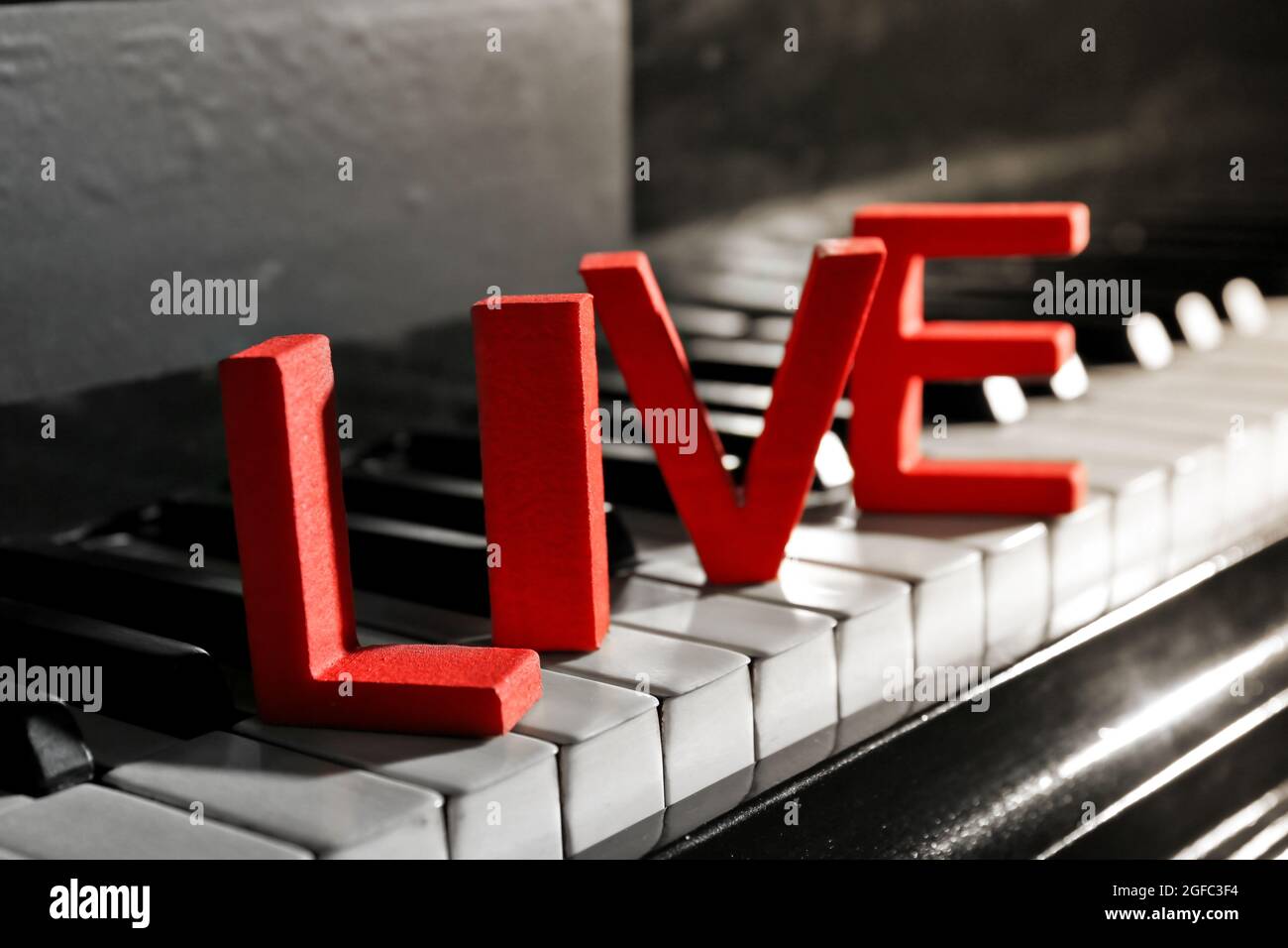 Word LIVE on piano keys, close up Stock Photo - Alamy