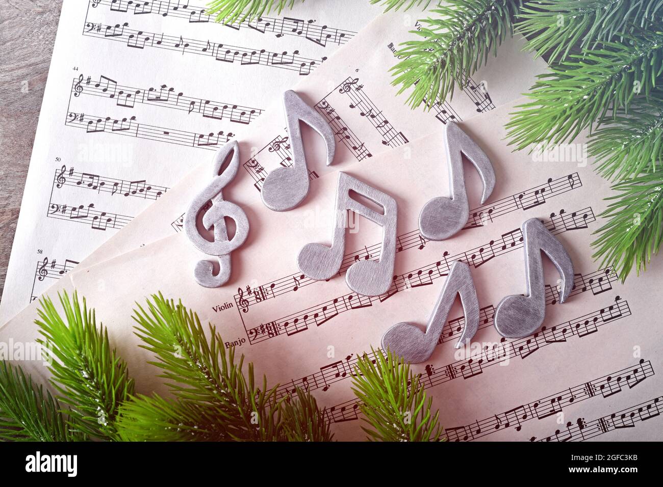 Music notes and Christmas tree on wooden background Stock Photo - Alamy