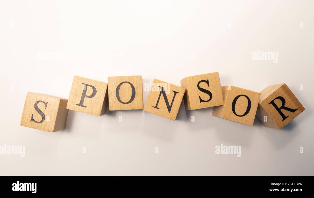 Sponsor word crafted from wooden cubesfinance and business. Close-up ...
