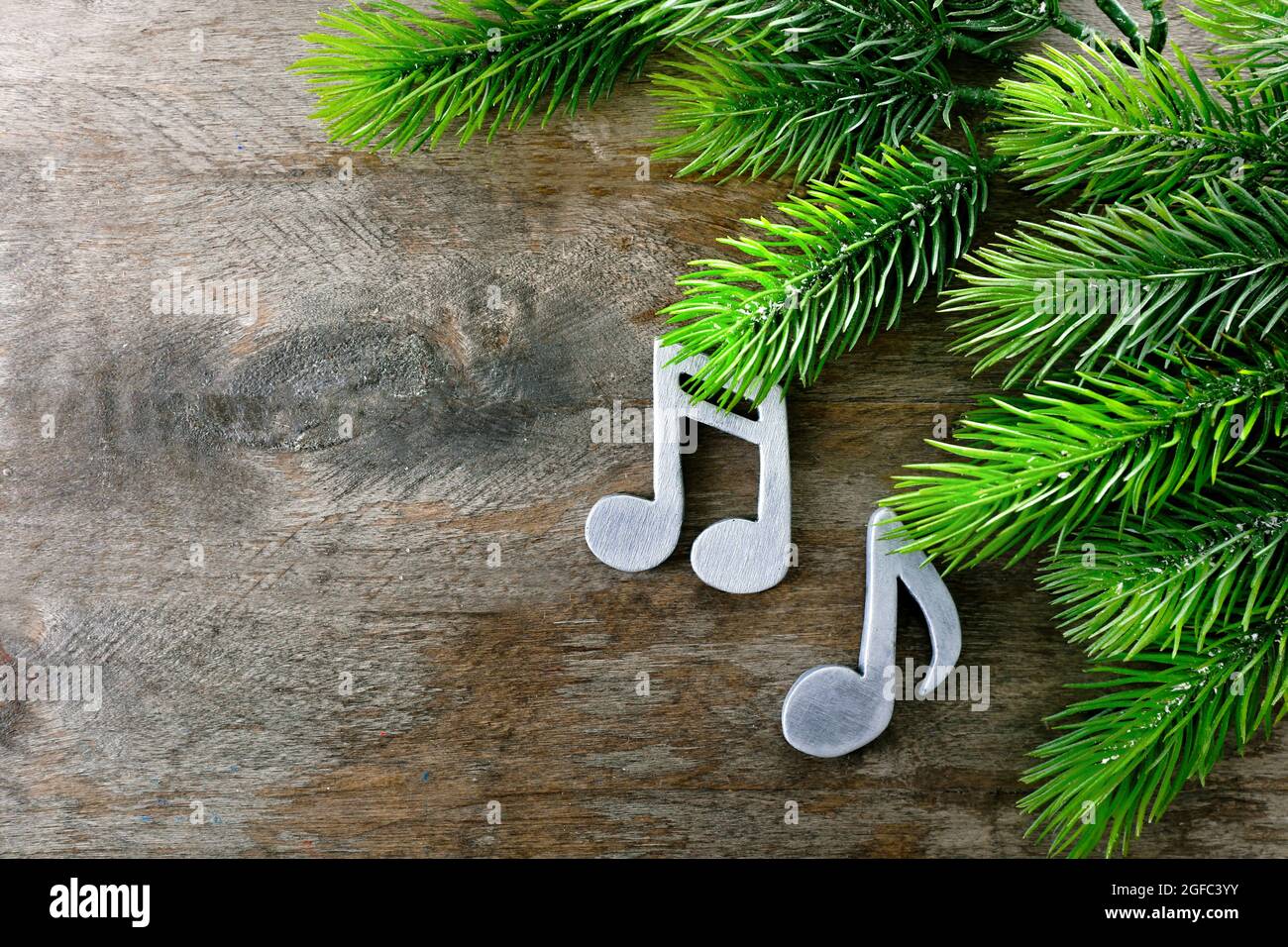 Music notes and Christmas tree on wooden background Stock Photo - Alamy