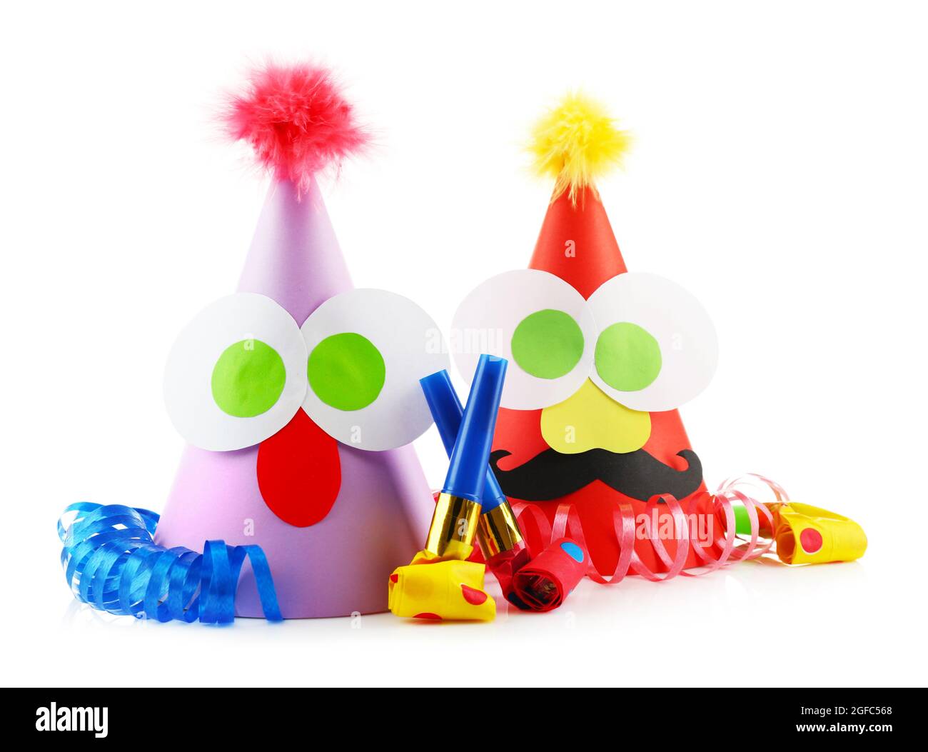 Funny party hats with blowers on a white background Stock Photo - Alamy