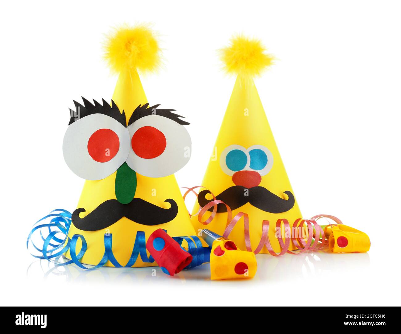 Funny party hats with blowers on a white background Stock Photo - Alamy