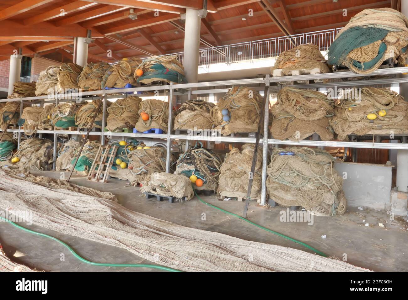 INSIDE OF THE STORAGE OF FISHING NETS AT SEA Stock Photo - Alamy
