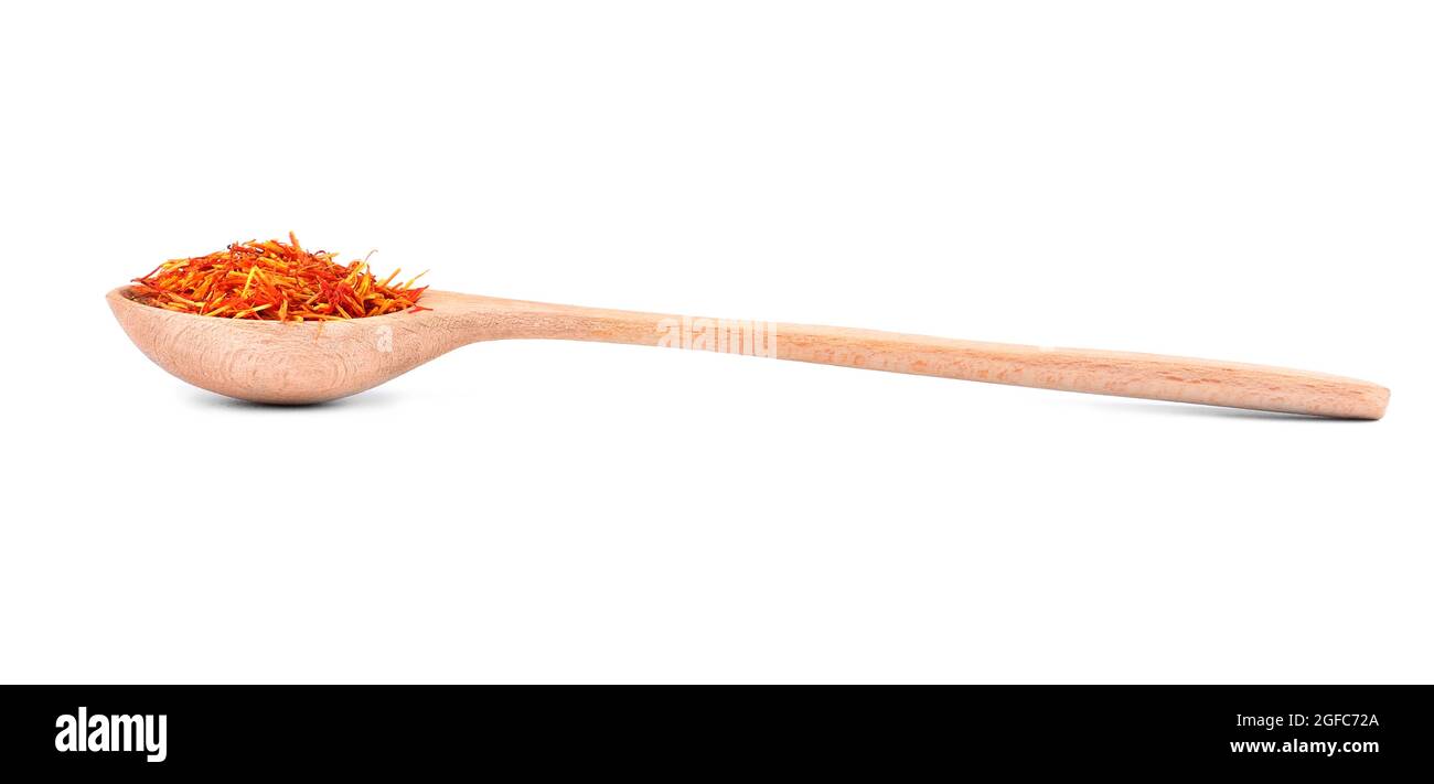 Dried saffron in spoon on white background Stock Photo - Alamy