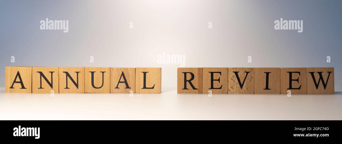 The word Annual review was created from wooden cubes.Close-up Stock ...