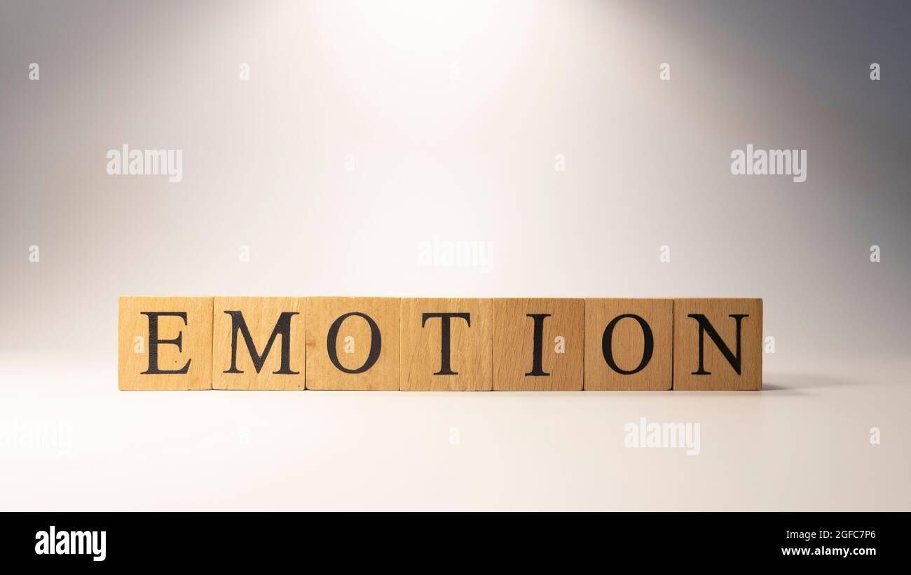 The word Emotion was created from wooden cubes. Psychology and feelings ...