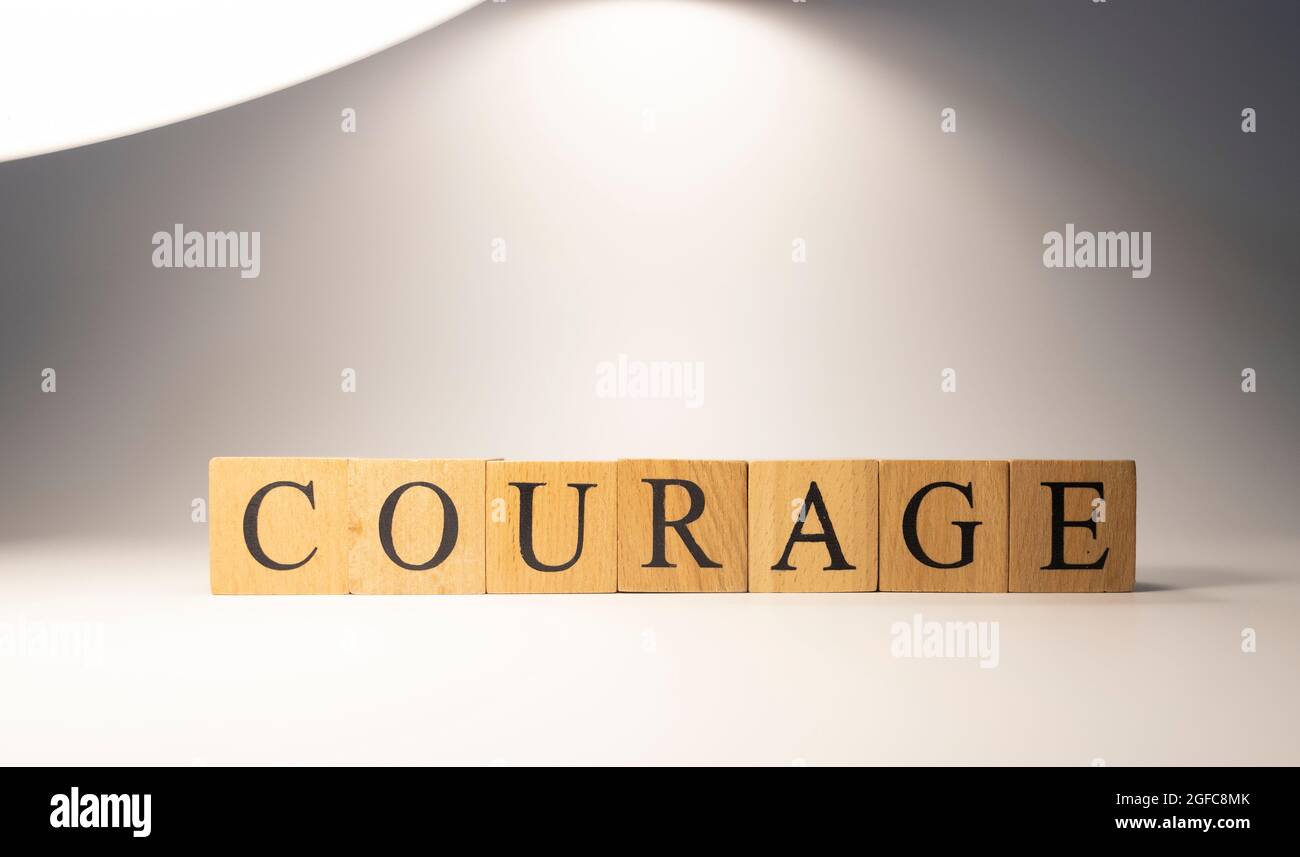 The word Courage was created from wooden cubes. People and emotions ...