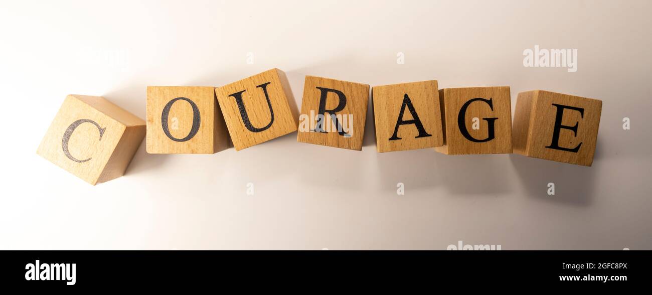 The word Courage was created from wooden cubes. People and emotions ...
