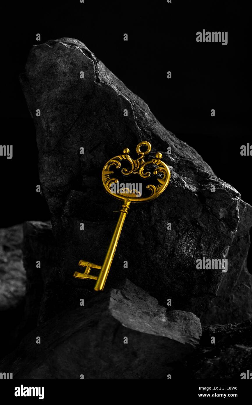 Antique Golden Key on Dark Black Textured Surface Background Stock ...