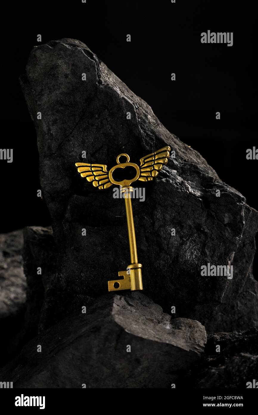 Antique Golden Key on Dark Coal Stone Surface Background Stock Photo ...