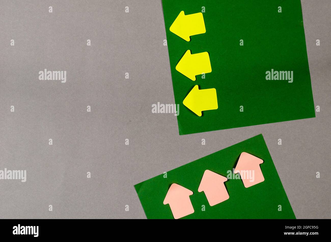 Square sheets of paper and bookmark arrows against a gray background ...