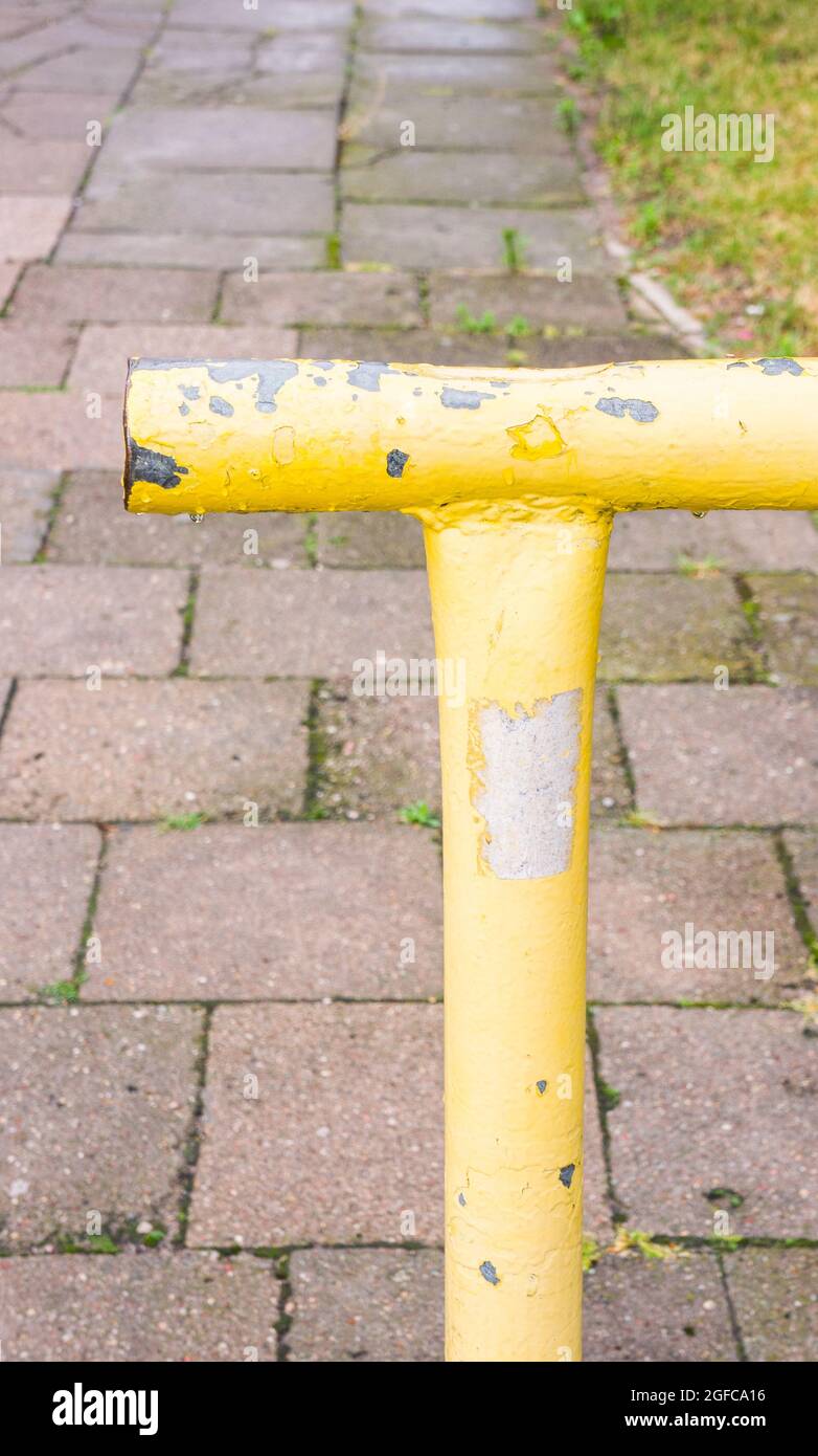 Vertical shot of a yellow T-shaped metal traffic barrier Stock Photo ...