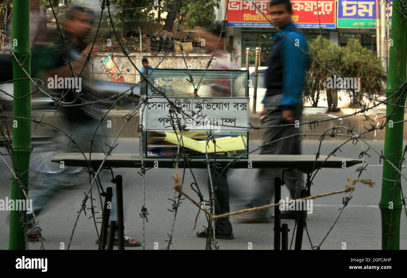 Two men crossing a police post fence. Bangladesh Stock Photo - Alamy