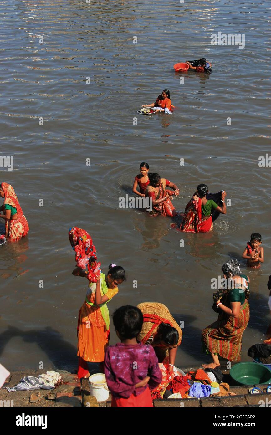 Thousands of people live around the River Buriganga. This river is the ...