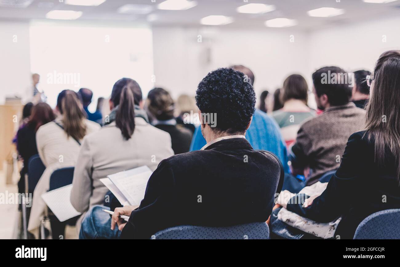 Woman giving presentation on business conference Stock Photo - Alamy