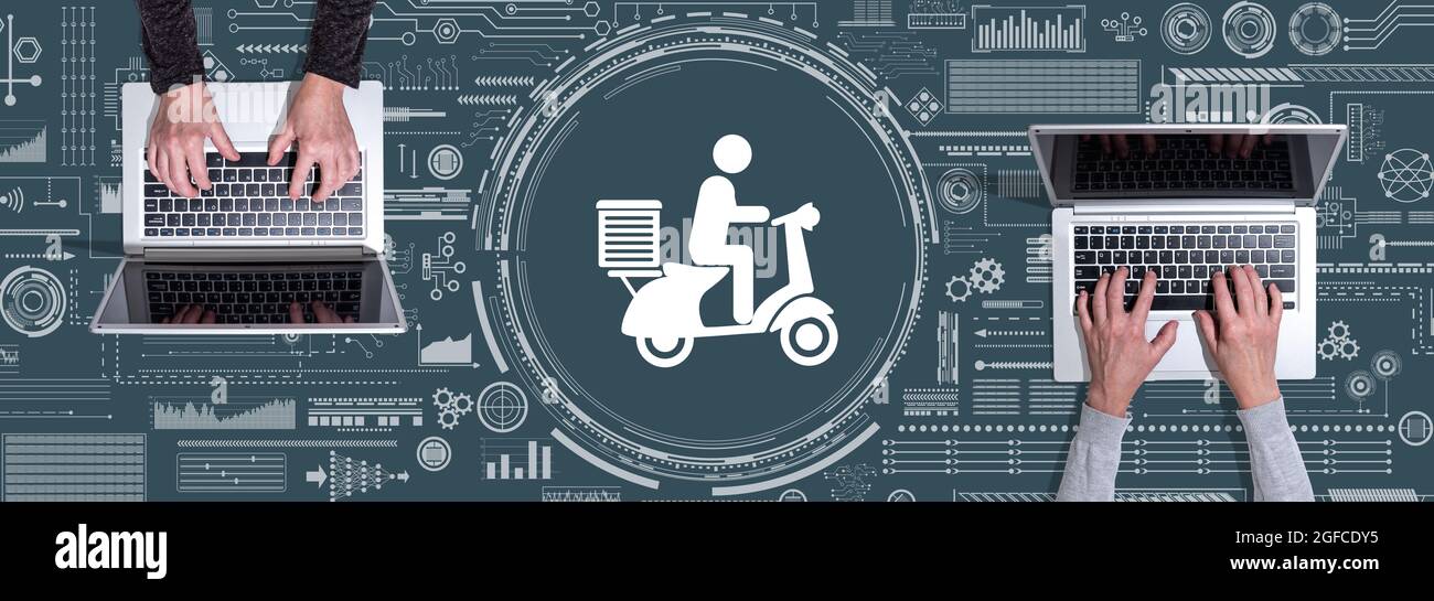 Top view of hands using laptop with symbol of delivery concept Stock ...