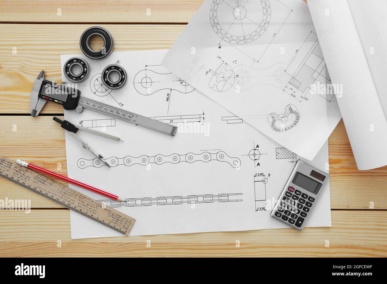 Engineering drawings of parts with tools, top view Stock Photo - Alamy