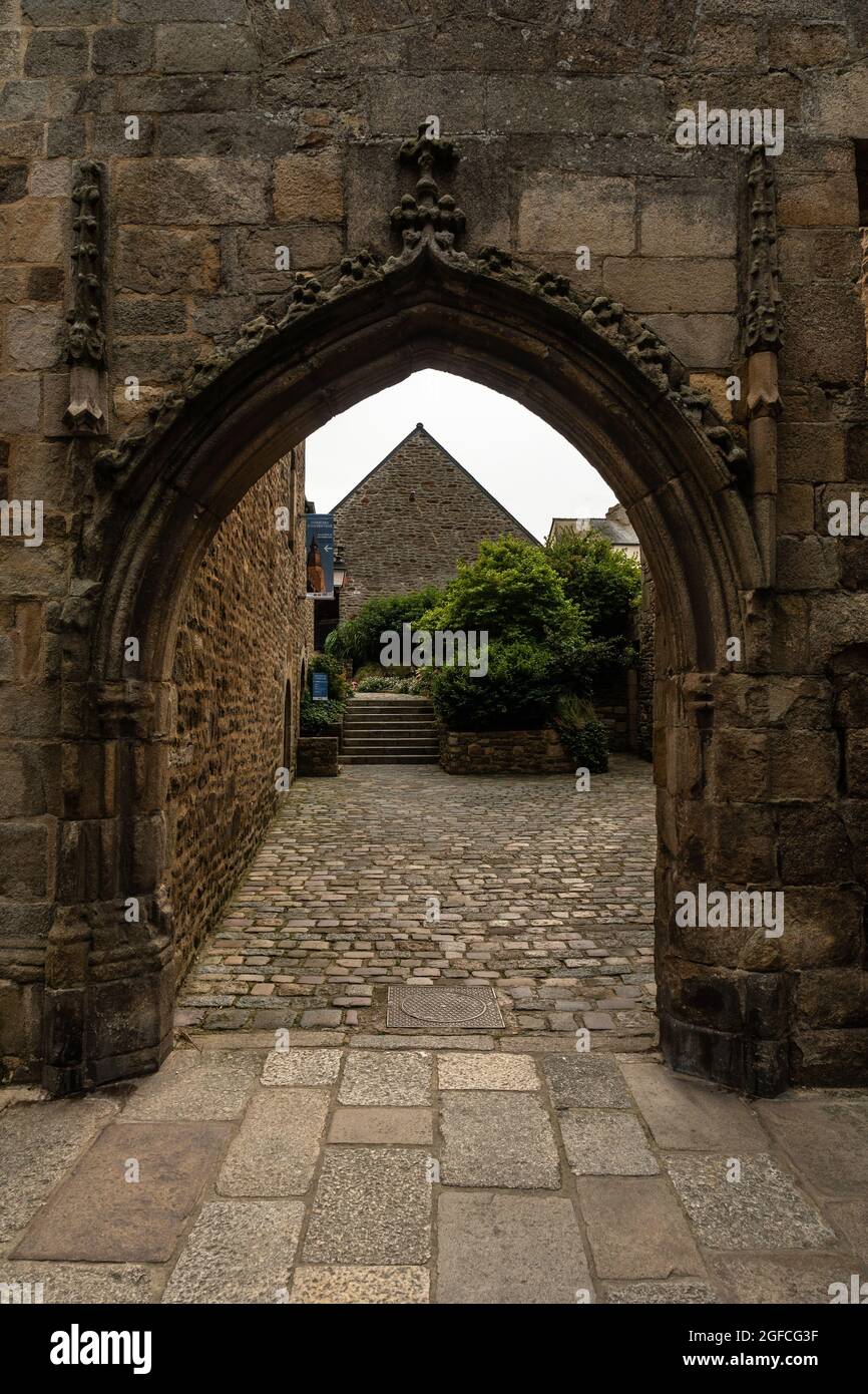 Vertical shot of an arched entryway at the medieval Dinan Castle in ...