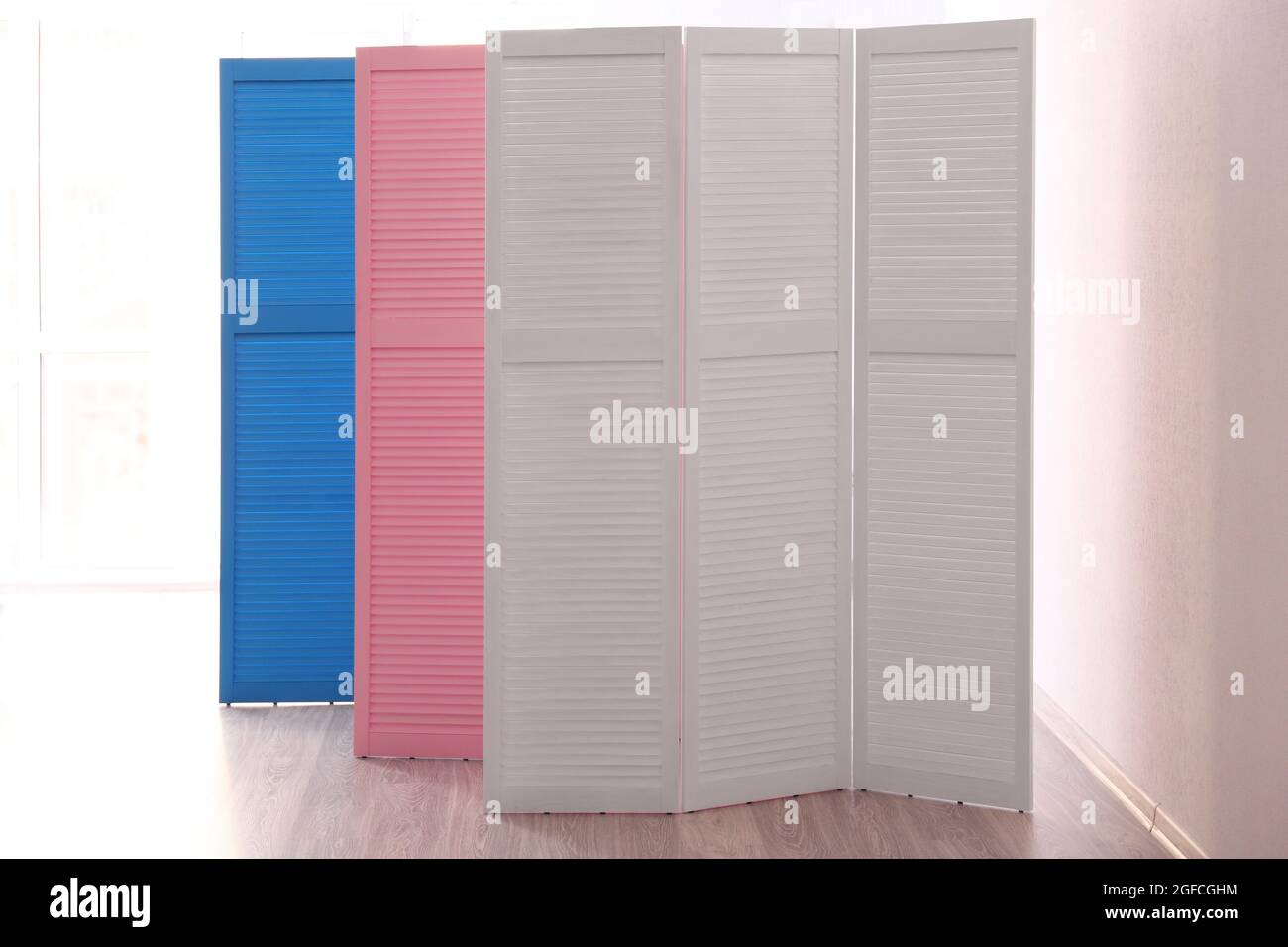 Color folding screens in room Stock Photo - Alamy