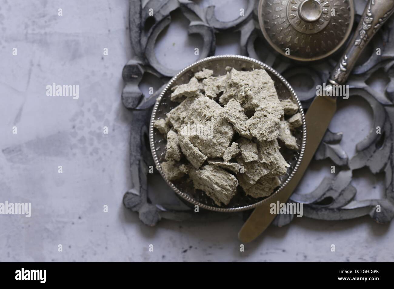 Eastern sweets - halva on a silver plate Stock Photo - Alamy