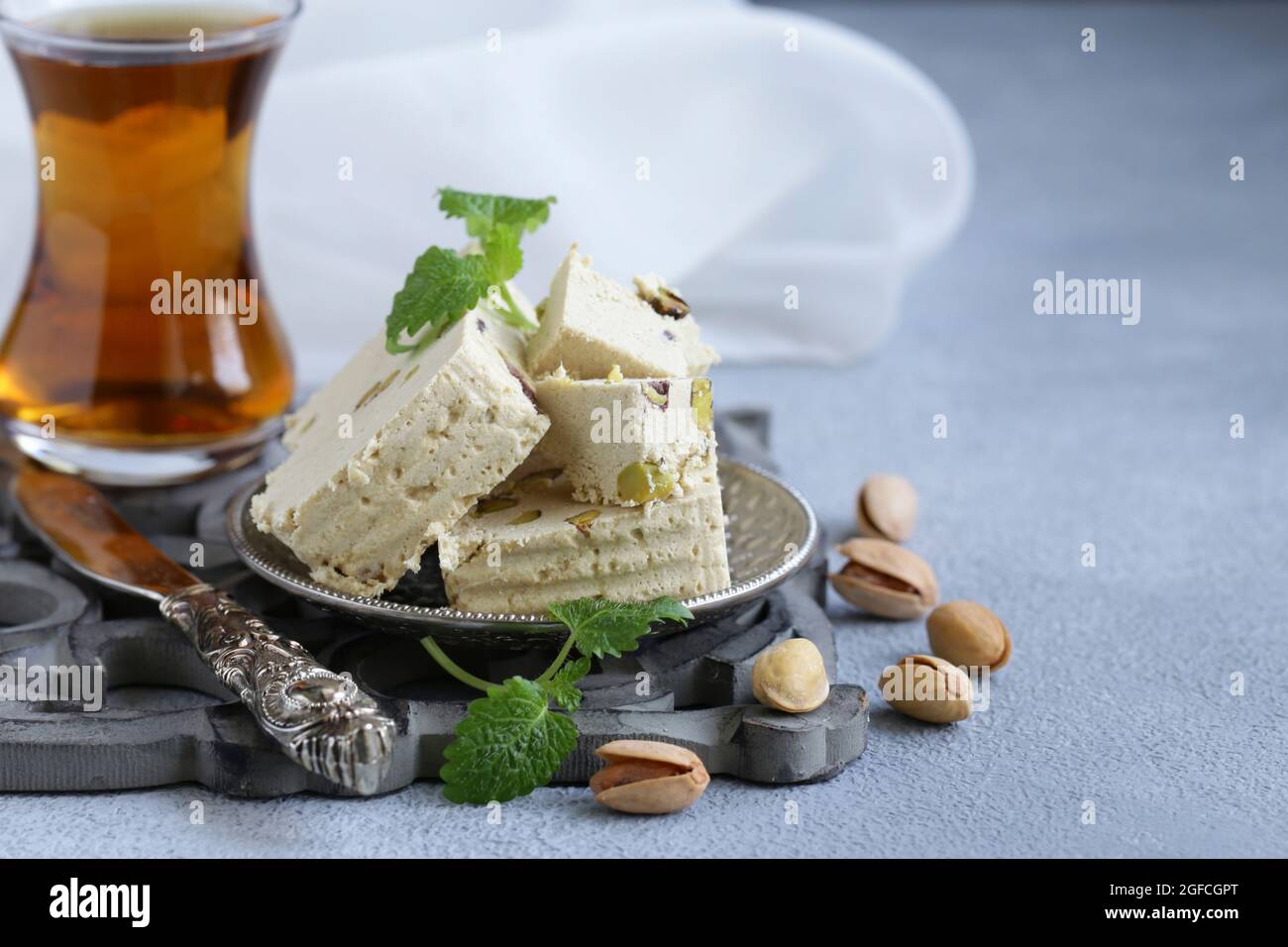 Eastern sweets - halva on a silver plate Stock Photo - Alamy