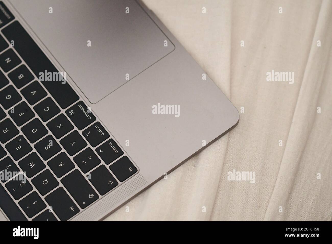 Overhead of a laptop computer in bed Stock Photo - Alamy