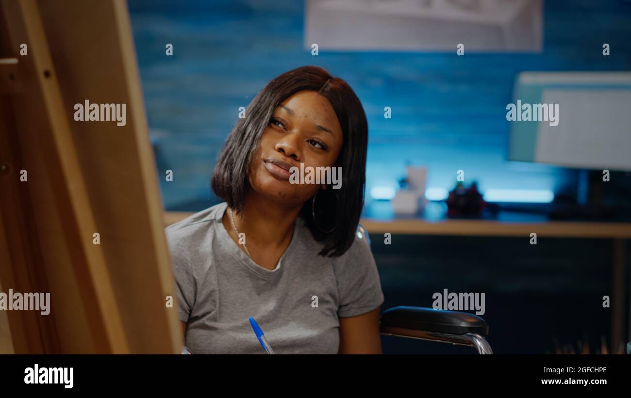 Portrait of african american woman with disability drawing sketch for ...