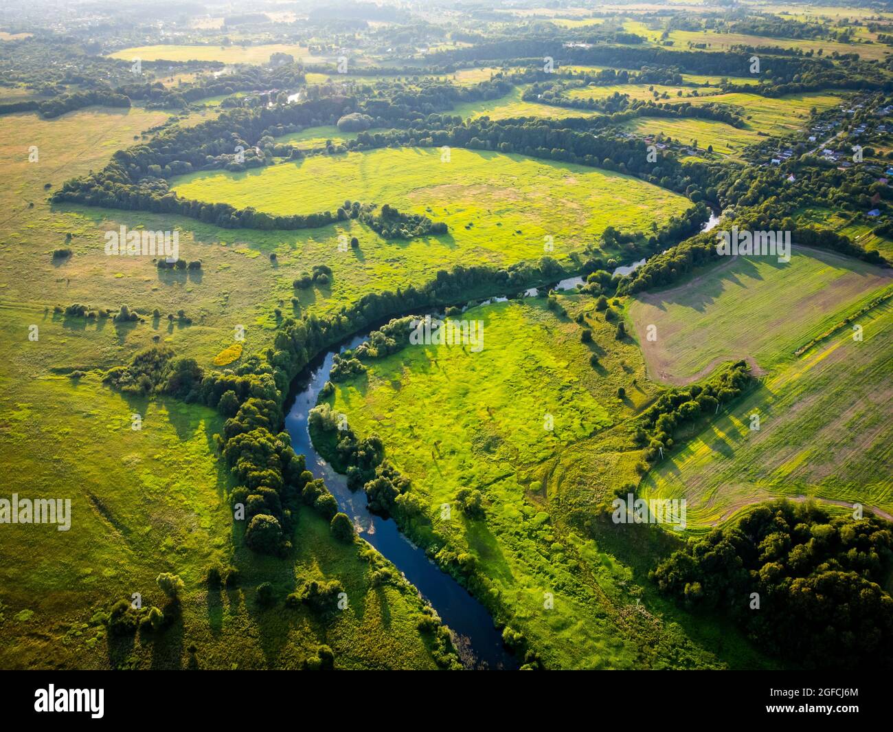Curvy river in green countryside Stock Photo - Alamy