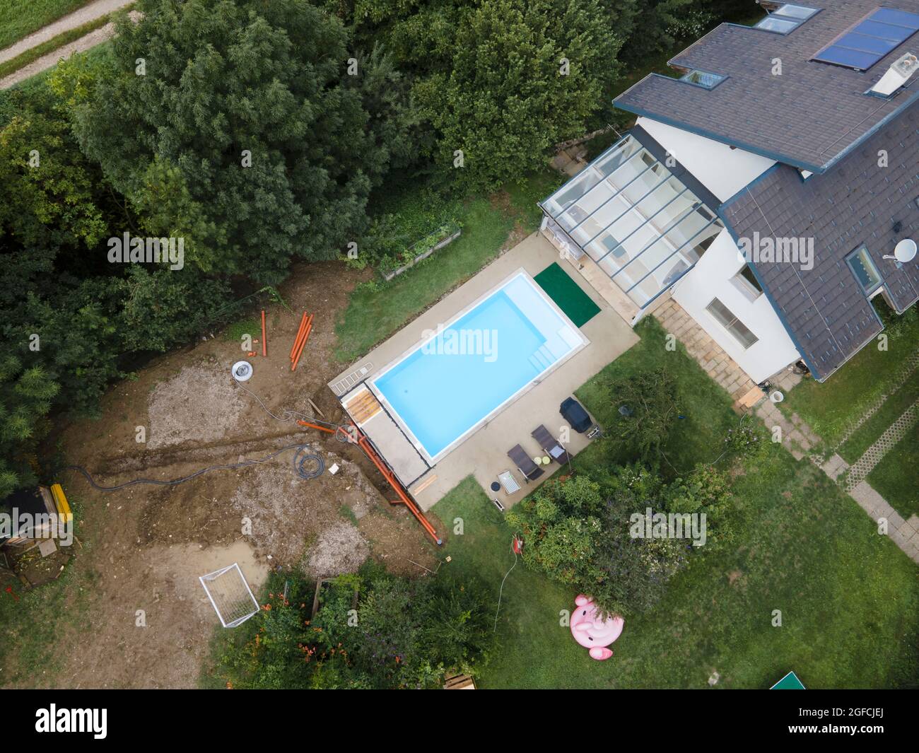 aerial drone flight of pool build construction site with pool filled ...