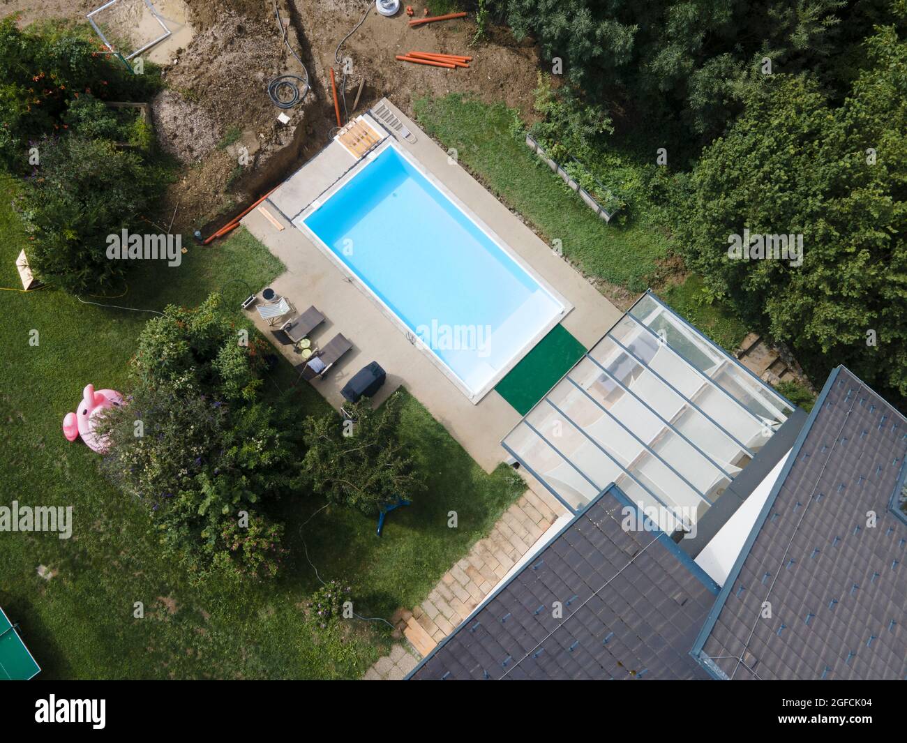 aerial drone flight of pool build construction site with pool filled ...