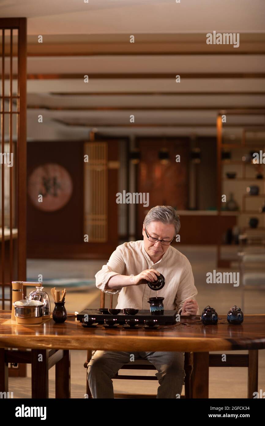 Senior man performing tea hi-res stock photography and images - Alamy