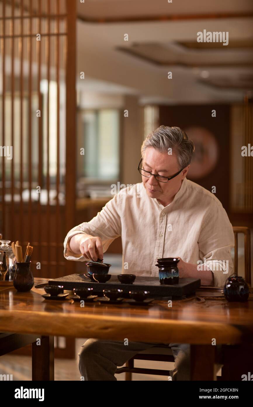 Senior man performing tea hi-res stock photography and images - Alamy