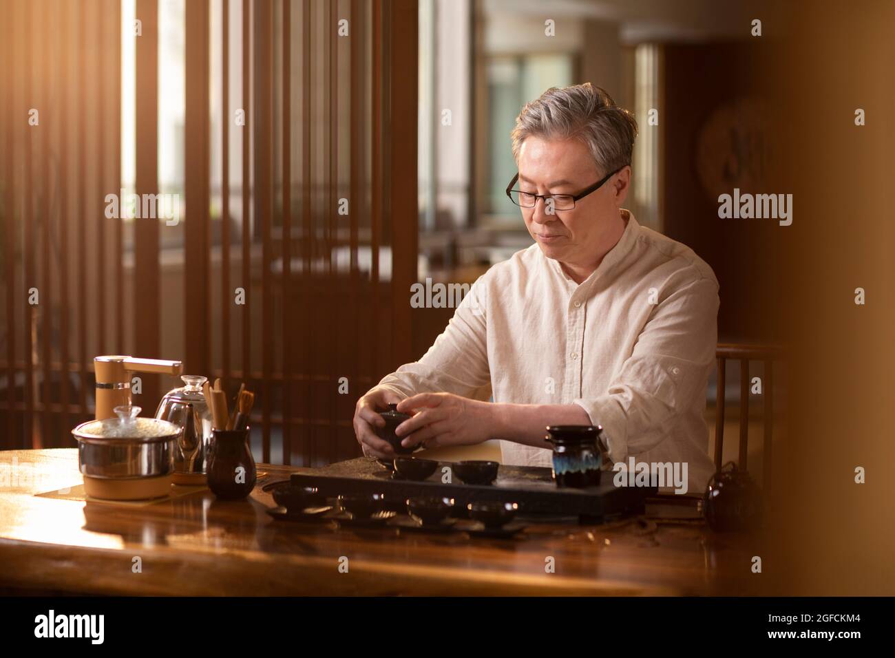 Senior man performing tea hi-res stock photography and images - Alamy