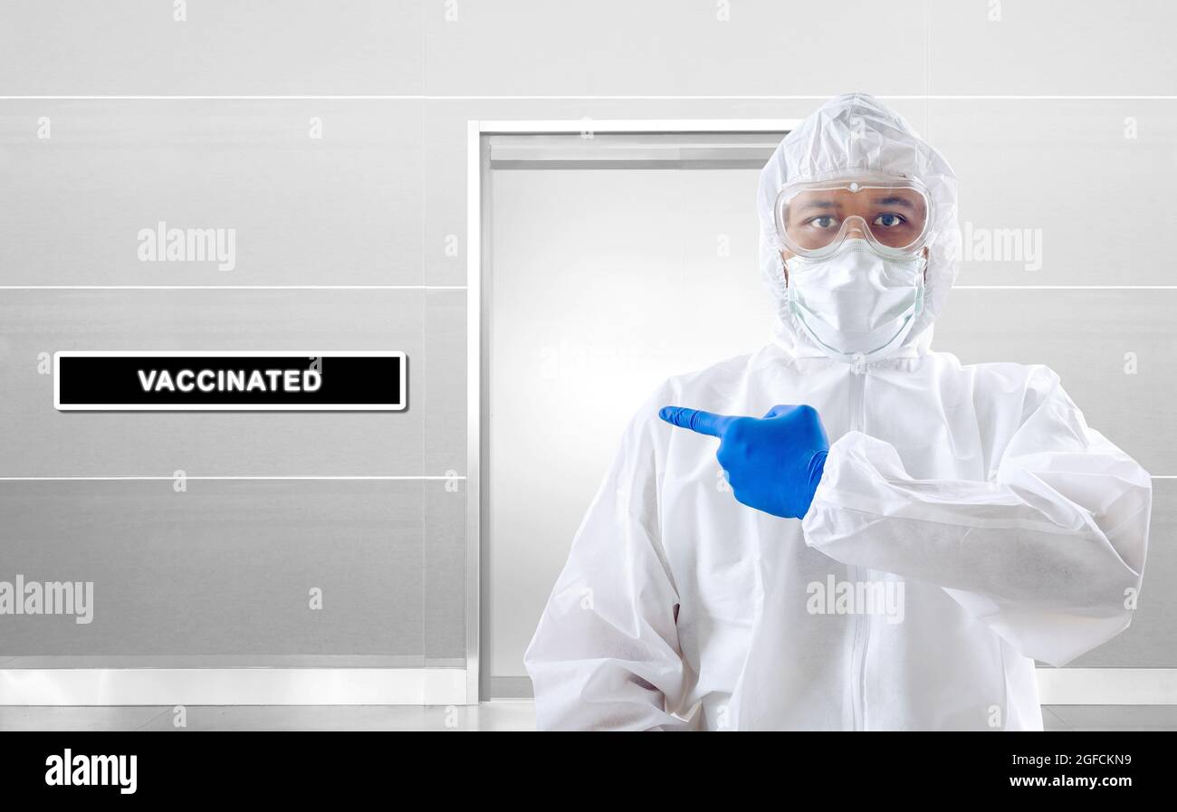 Health worker man with a protective suit and gloves standing with ...