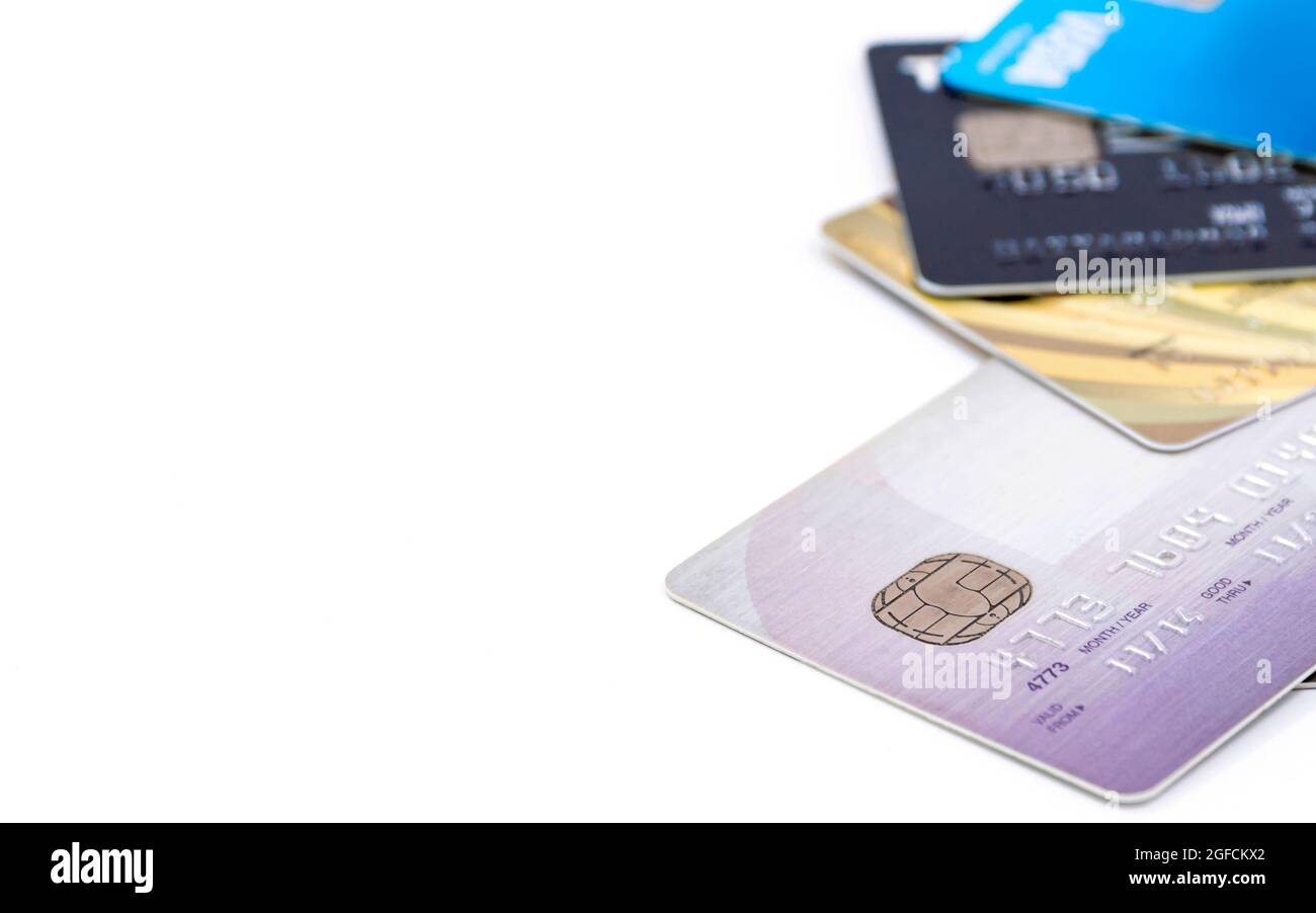 Selective focus of group of multi colored bank credit cards on white ...