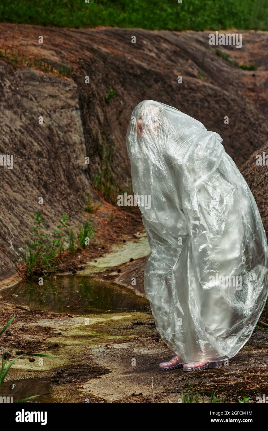 model girl wrapped in cellophane. art. concept. texture earth on ...