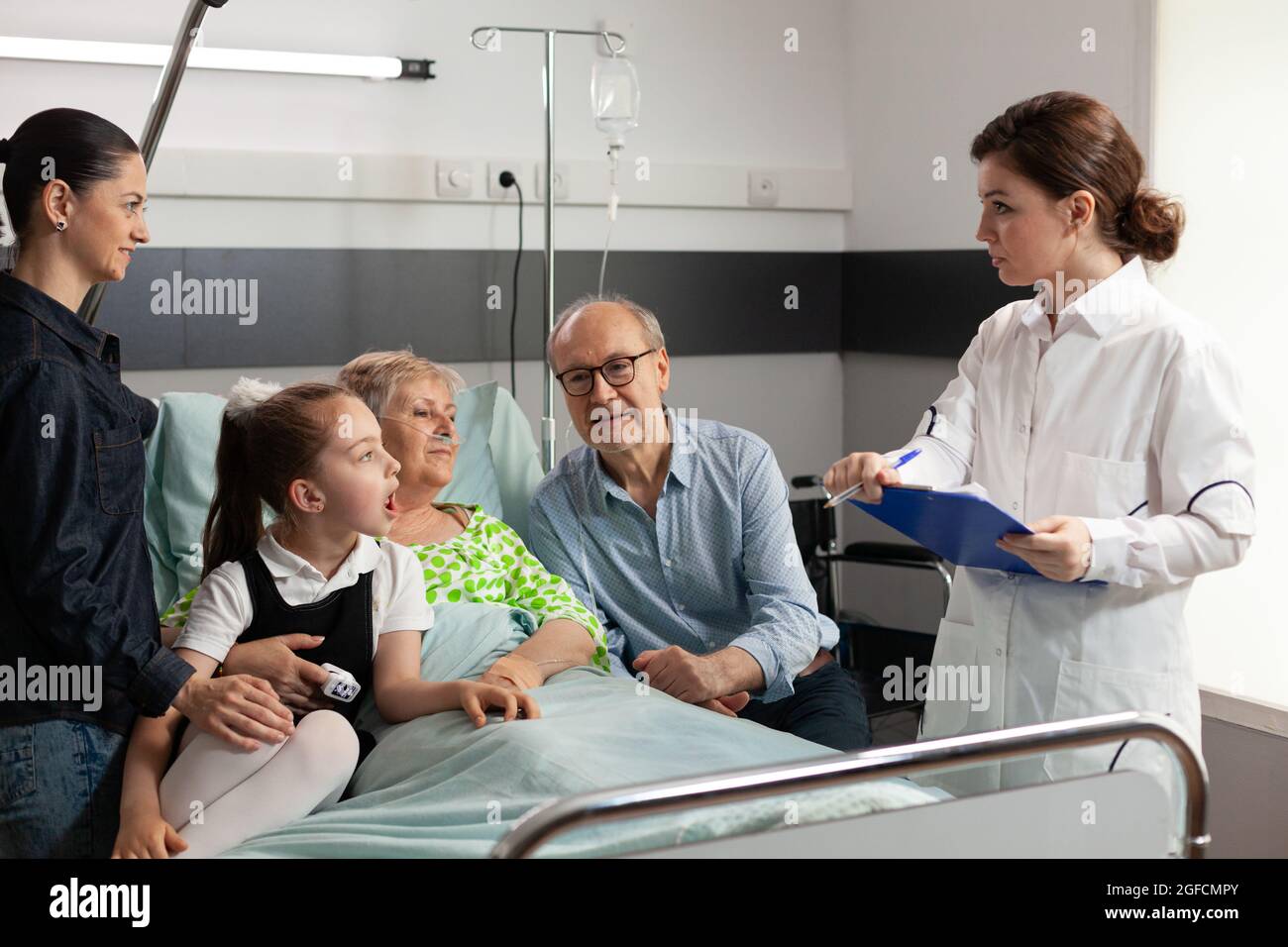 Physician doctor discussing sickness symptoms with retired elderly ...