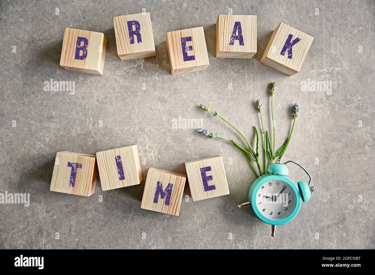 Wooden cubes with clock on a color background. Break time concept Stock ...