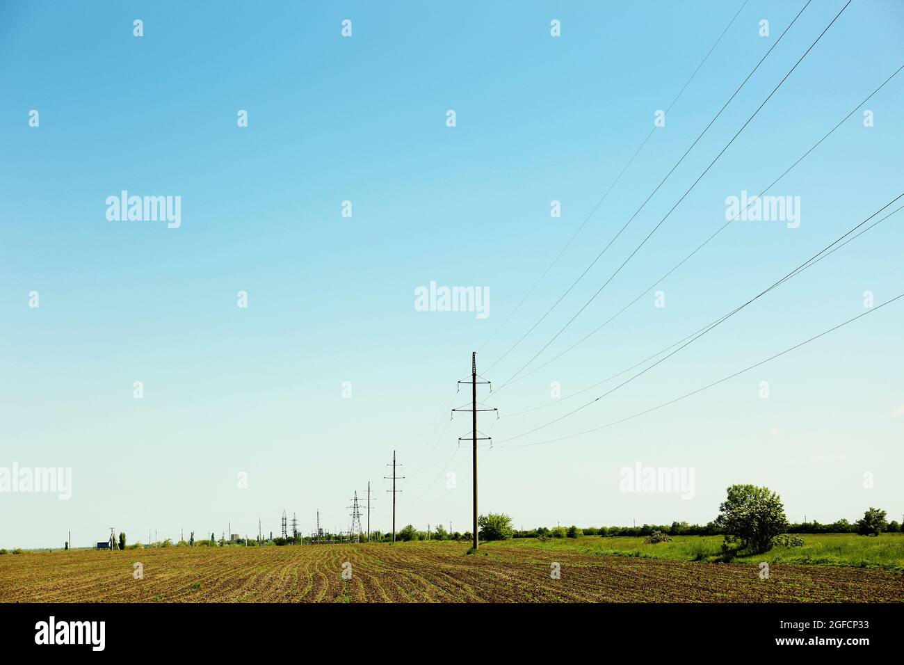 High voltage tower in field Stock Photo - Alamy