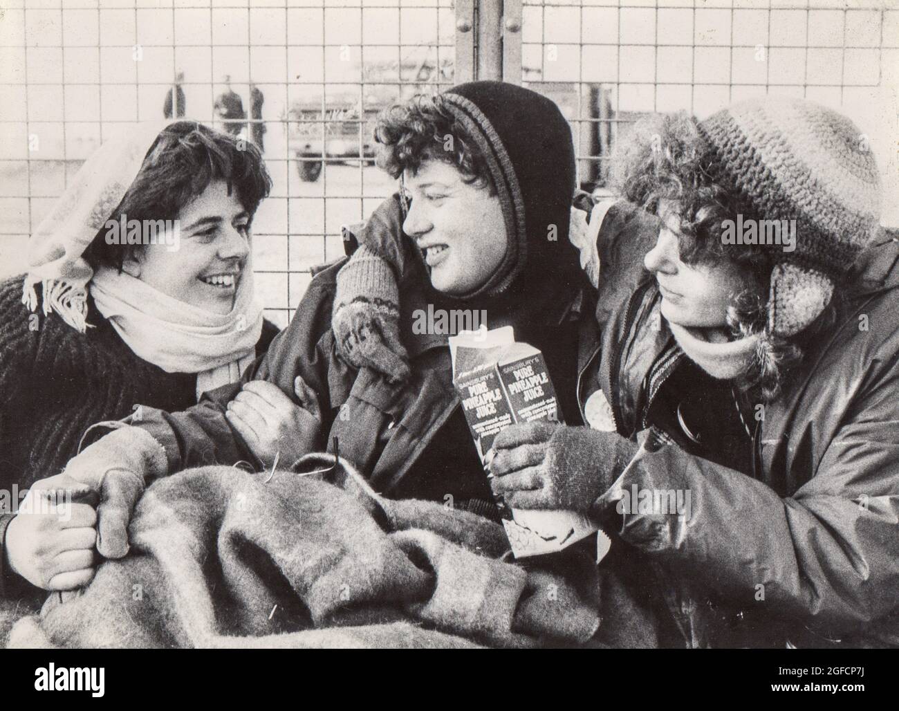 Women gather around the perimeter fence at Greenham Common Womens Peace ...