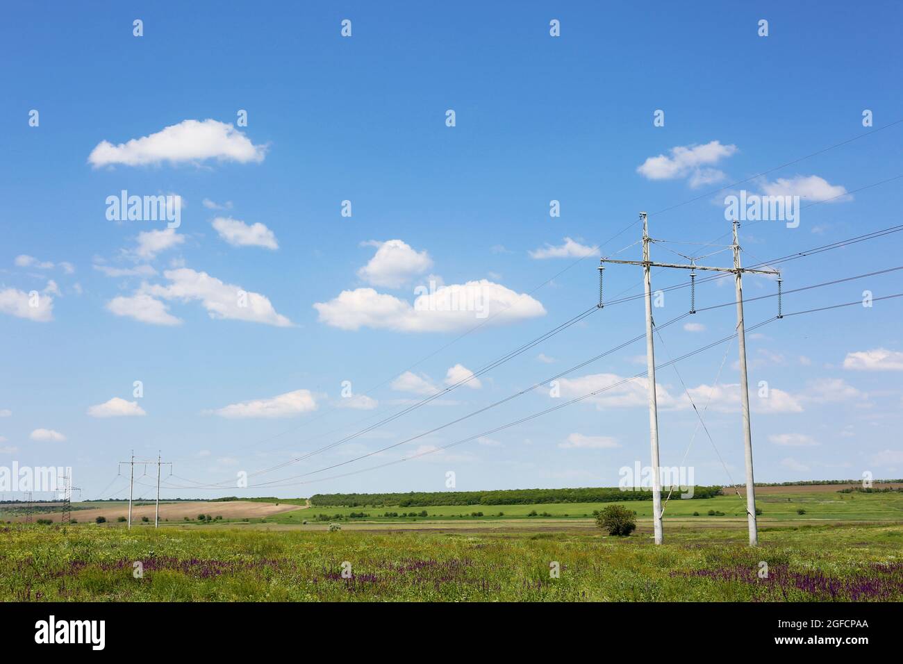 High voltage tower in field Stock Photo - Alamy