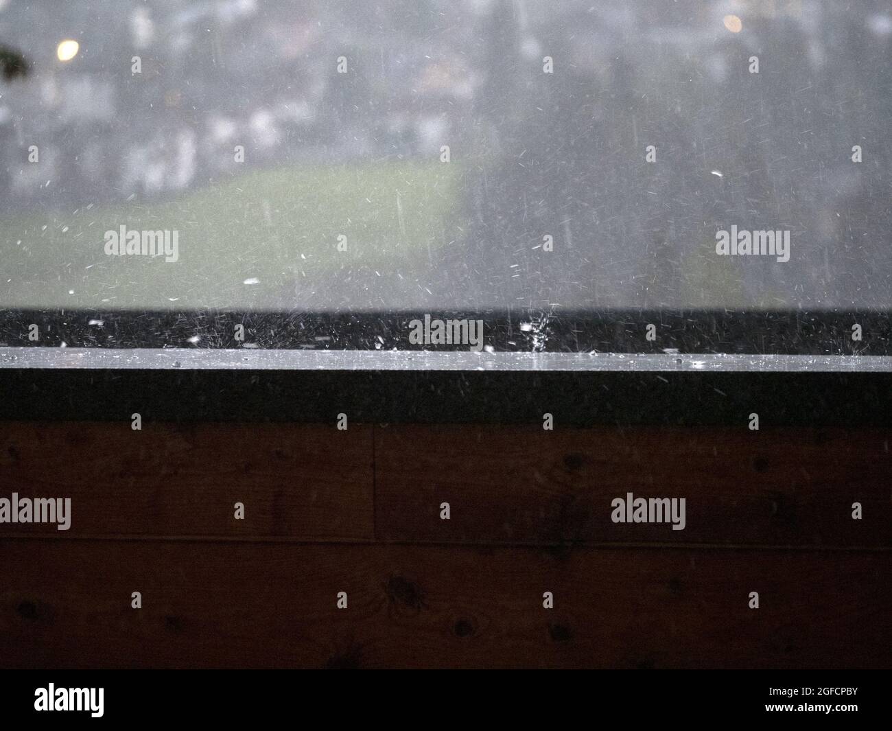 hailstorm on balcony in mountain detail of hailstones while falling ...