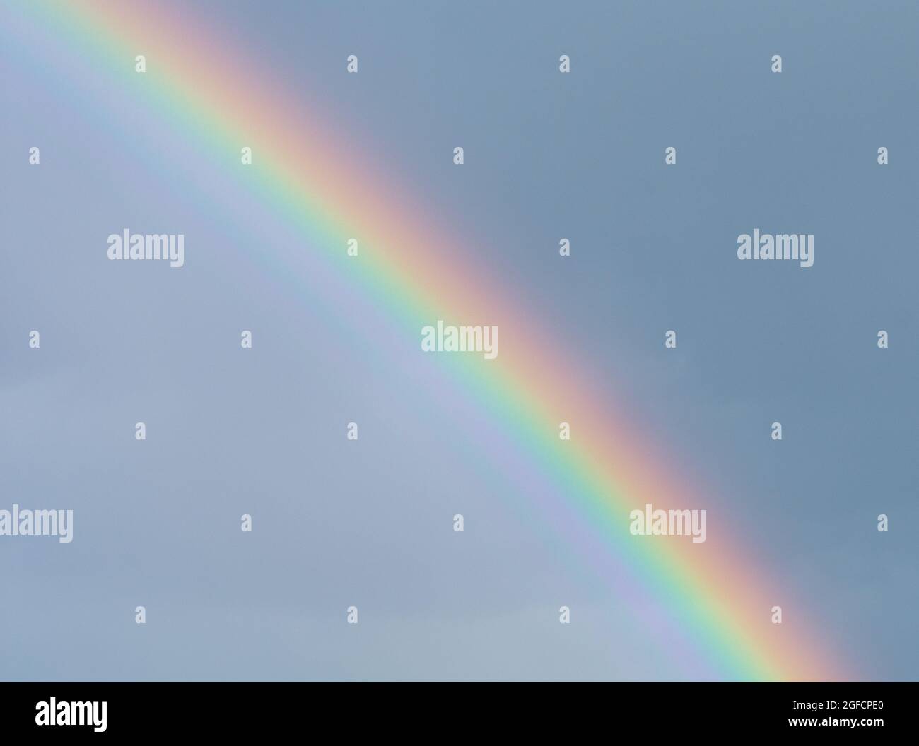 Beautiful rainbow in a blue sky Stock Photo - Alamy