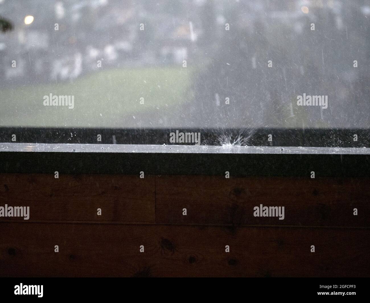 hailstorm on balcony in mountain detail of hailstones while falling ...