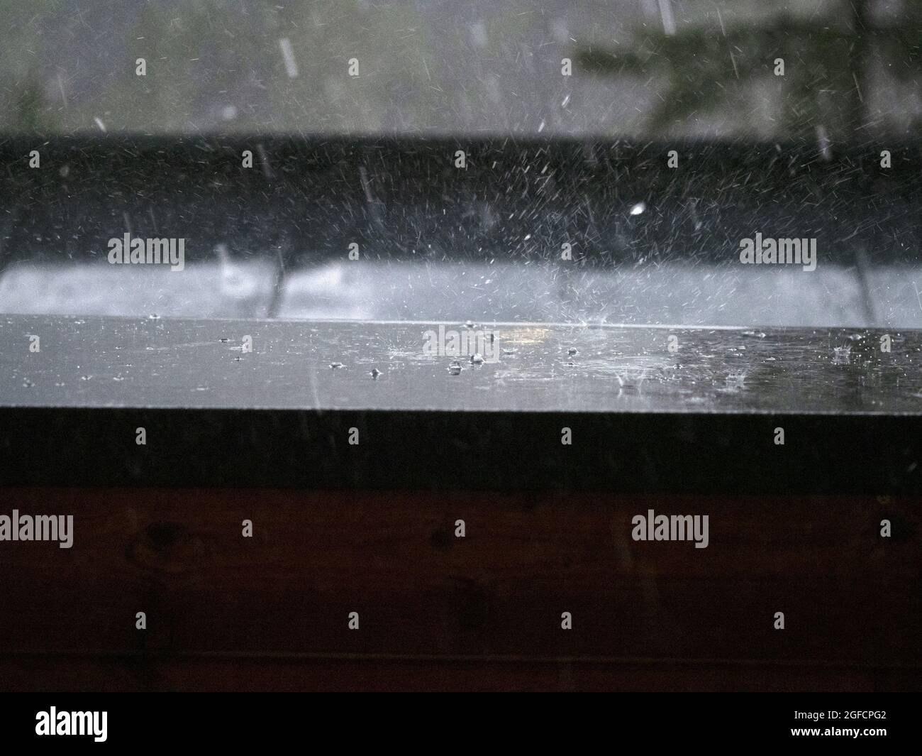 hailstorm on balcony in mountain detail of hailstones while falling ...
